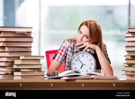 Female Babe With Clock Preparing For Exams Stock Photo Alamy