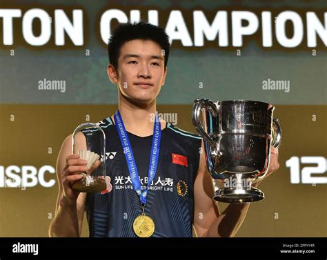 Chinas Li Shi Feng Poses With Trophy After Winning The Mens Final Match Against Chinas Shi Yu