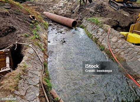 Construction Of Flood Control Measures Where Half Of The Stream Is