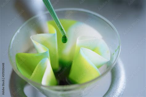 The Scientist Is Testing The Natural Product Extraction And Green Color Solution In The