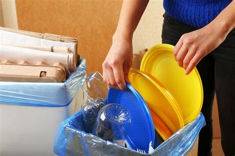 Premium Photo Woman Sorting Different Waste Indoors