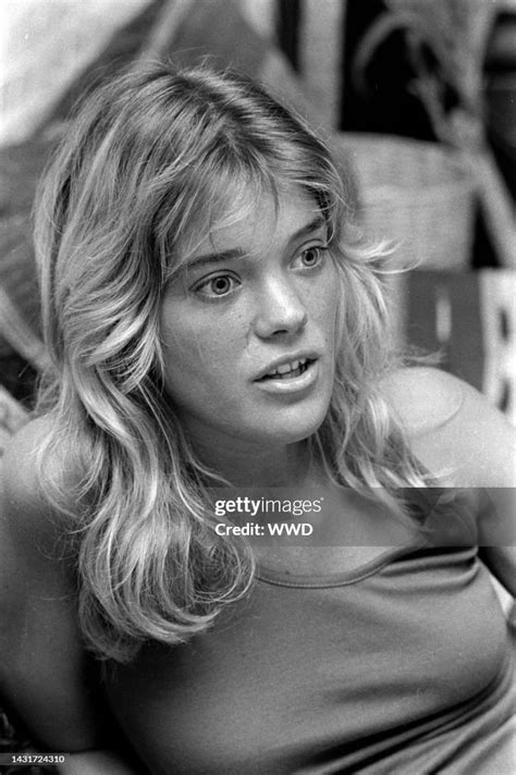 Photographer Berry Berenson Wearing A Tank Top Shorts A Large
