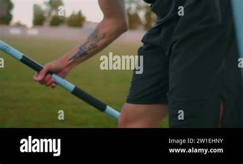 Close Up Hand A Male Athlete At The Stadium Takes A Javelin For Throwing And Prepares To Make A