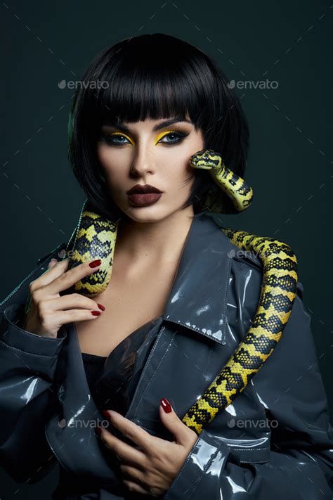 Beauty Woman Python Yellow Snake Around Her Neck On Latex Shiny