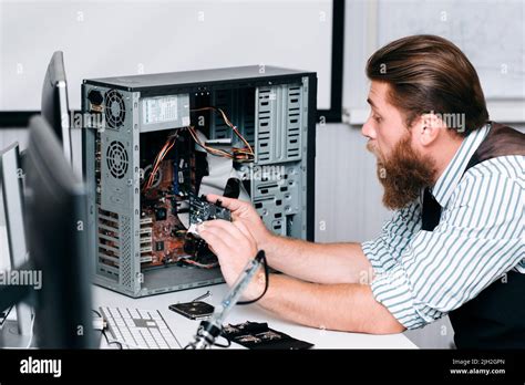 Repairman Disassembling Computer Unit For Repair Stock Photo Alamy