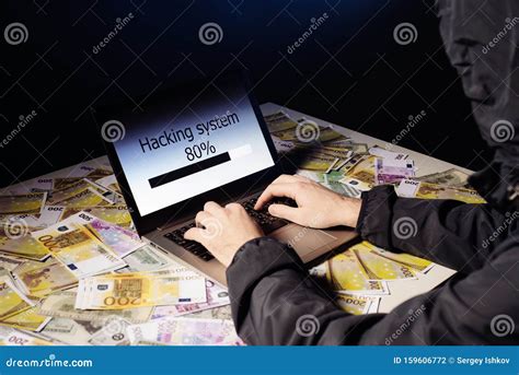 anonymous hacker programmer uses a laptop to hack the system in the dark creation and infection