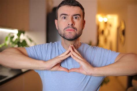 Man Making A Weird Triangular Symbol With His Hands Stock Image Image