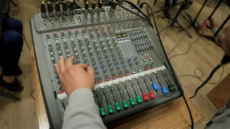 A Man Tuning Microphone Volume With An A Stock Video Pond