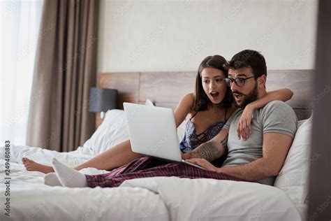 Couple Watching Sex Video On Laptop Laughing Together People Sexual Technology Concept