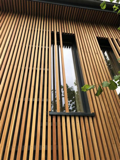Timber 🌲 Siberian Larch Elegance 🌲 Check Out This Stunning Vertical Batten Cladding Using