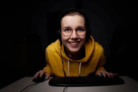 Premium Photo Girl Gamer Playing A Video Game On A Computer At Night