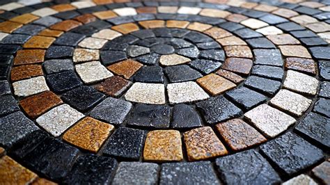 Abstract Swirling Stone Mosaic Multicolored Cobblestone Pavement Design Creates A Captivating