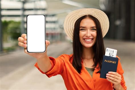 Premium Photo Cheerful Lady Passenger Displaying Smartphone Screen