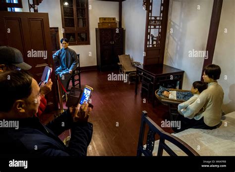 Visitors Take Photos Of Sculptures Of Chairman Mao Zedong Left And