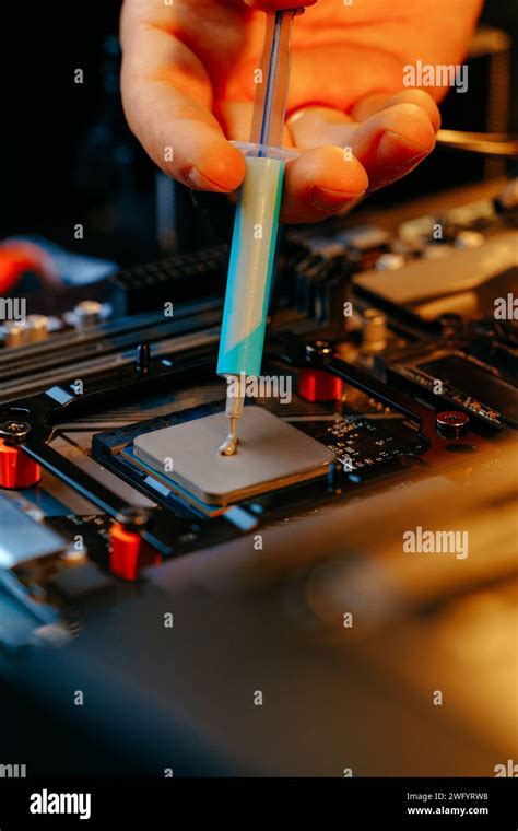 Applying Thermal Paste To A Computer Processor Stock Photo Alamy