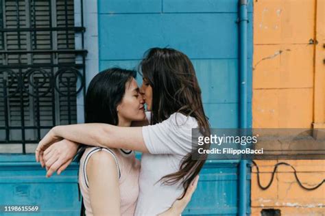 Interracial Lesbian Couple Kissing Photos And Premium High Res Pictures