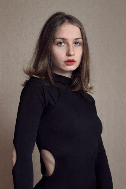 Premium Photo Portrait Of Young Woman Young In Black Suit Looking At