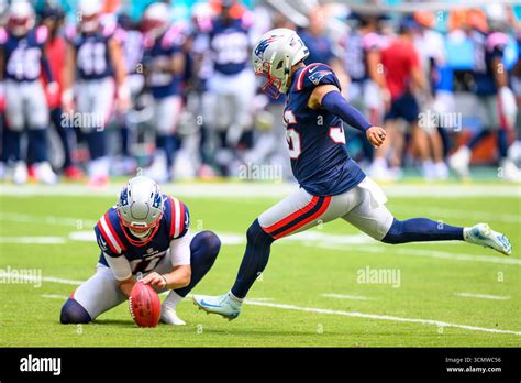 New England Patriots Punter Bryce Baringer 17 Holds The Ball As Kicker Andy Borregales 36