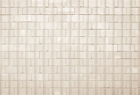 넓은 크림 벽돌 벽 질감의 빈 배경 베이지색 오래 된 갈색 벽돌 벽 콘크리트 또는 돌 질감 벽지 석회암 추상 바닥 그리드 고르지 않은 내부 암석 가정 장식 디자인 배경입니다