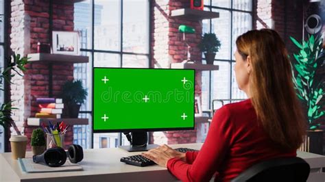 Independent Person Using Computer With Green Screen For Remote Job