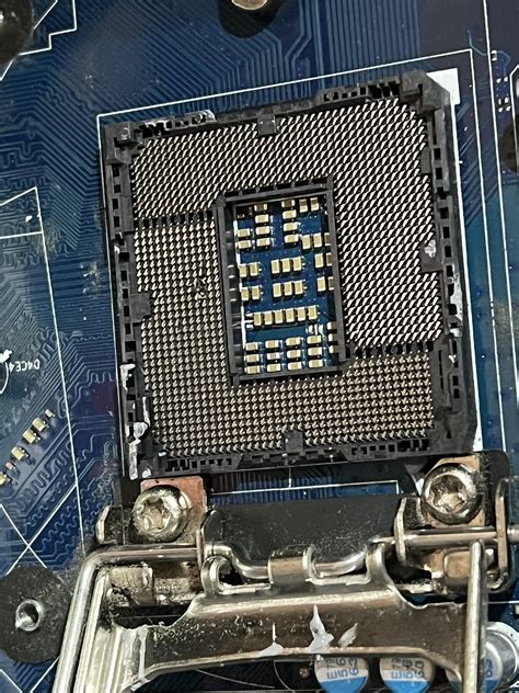 Bent CPU Socket Pins I Cant See Them Very Well To Bend Them Back Is This Salvageable Any