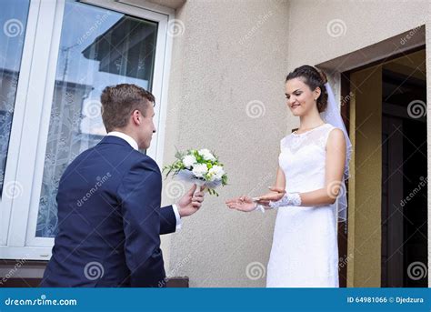 The Groom Gives The Bride Flowers Stock Photo Image Of Love Beauty