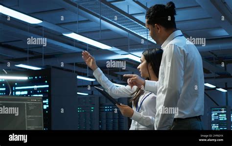 admins in data center managing and maintaining databases using device