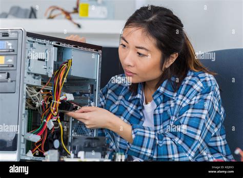 Asian Lady Repairing Computer Stock Photo Alamy