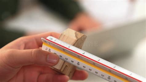 A Video Of Skilled Architect Or Engineer Use Scale Ruler Measuring