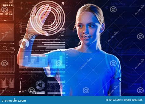 Smiling Girl Using A Security System And Touching The Screen Stock