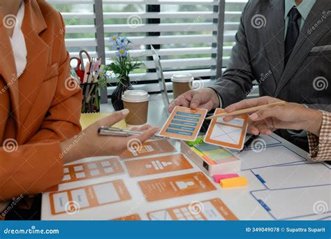 Ux Developer And Ui Designer Presenting Mobile App Interface Design On