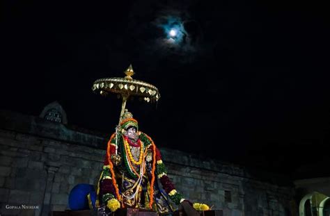 The Statue Is Decorated With Colorful Garlands And Lights