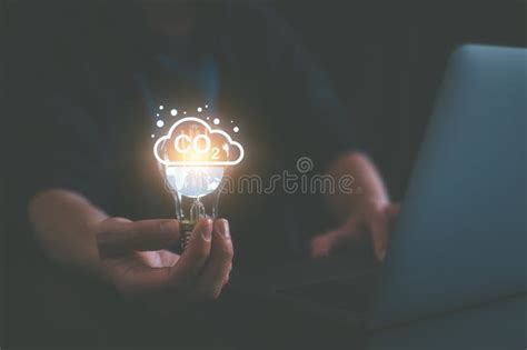 Hand Holding Light Bulb Sign Of Co2 Reducing Icon Concept Of Decrease Carbon Dioxide Emission