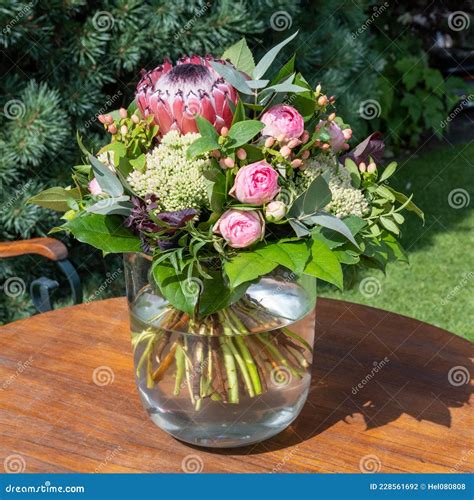 Flower Bouquet With Protea Sedum And Pink Roses Beautiful Summer Flower Arrangement In Glass