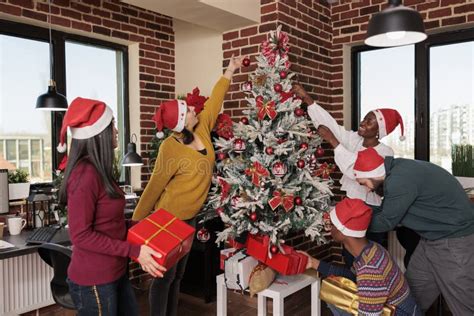 Festive People Giving Ts Under Christmas Tree Stock Image Image Of