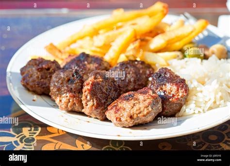 Lamb Kofta With Rice French Fries Olives On White Plate In Moroccan