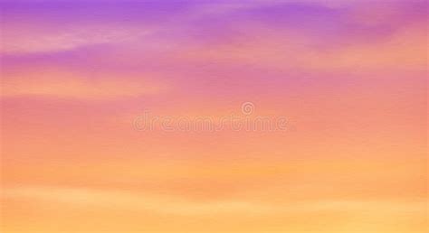 Soft Gradient Sky With Subtle Clouds In Purple And Orange Hues Stock