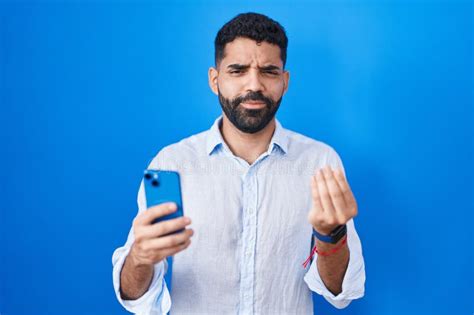 Hispanic Man With Beard Using Smartphone Typing Message Doing Money