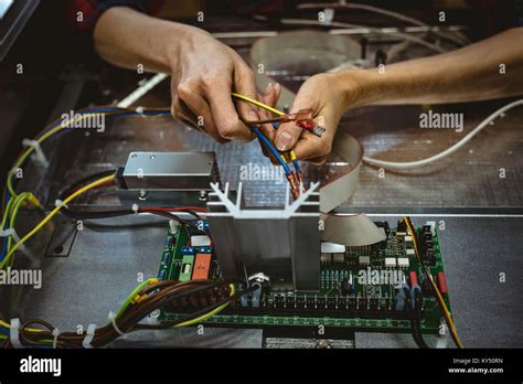Female Worker Attaching A Wire On Circuit Board Stock Photo Alamy