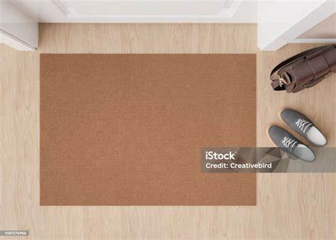 집 바닥에 빈 갈색 도어 매트 텍스트를 위한 복사 공간이 있는 환영 매트 현관 매트 모형 더러운 신발을 닦기 위해 입구에 카펫이 깔려 있습니다 모형 3d 렌더링 깔개에 대한