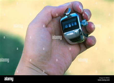 Tally Counter Held In Woman S Hand Stock Photo Alamy