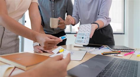 Premium Photo Close Up Ux Developer And Ui Designer Brainstorming Interface Wireframe