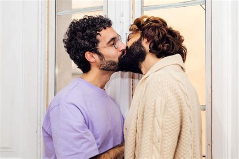 Premium Photo Happy Couple Of Gay Men Kissing At Home
