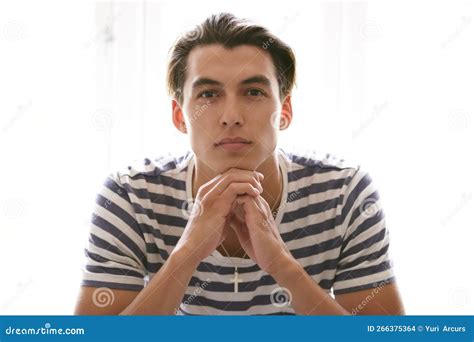 Thinking Deeply Young Guy Sitting Indoors While Deep In Thought Stock