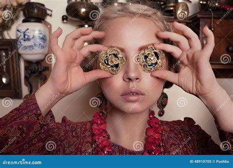 Beautiful Young Blonde Girl In Retro Interior In Motley Turkish Dress