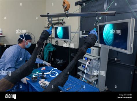 Female Surgeon Using Medical Device In Operation Theatre Stock Photo Alamy