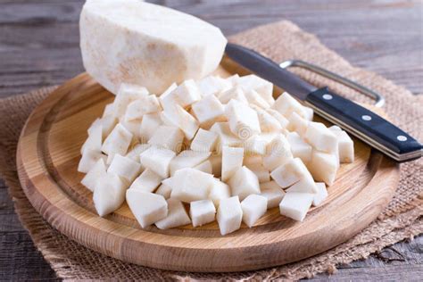 Root Celery Cut Into Small Pieces With The Half Of The Whole Celery