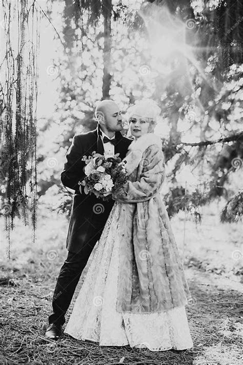 Romantic Fairytale Happy Newlywed Couple Hugging And Kissing In A