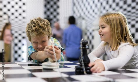 Babe Adn Girl Solving Puzzle Together In Quest Room Stylized Like Chessboard Stock Photo Adobe