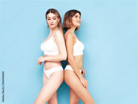 Fashion Portrait Of Two Young Beautiful Women Attractive Carefree